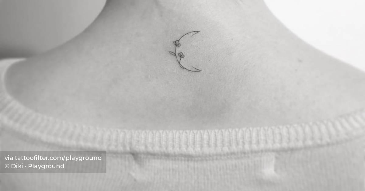 Fine line minimalistic flower moon tattoo placed on the