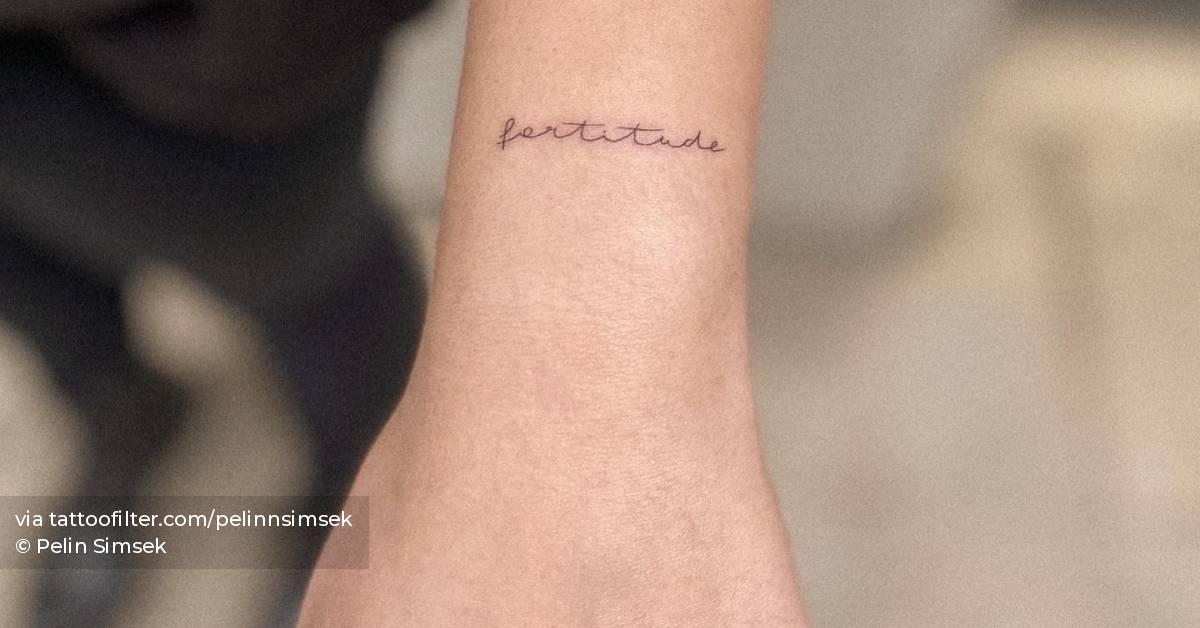 Tattoo of the word "fortitude" located on the wrist.