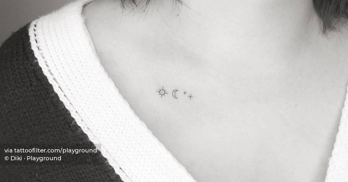 Fine line sun, moon and stars tattooed on the