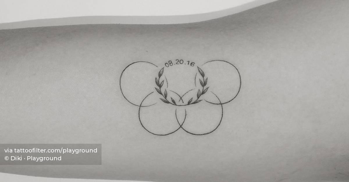 Olimpic rings tattooed on the inner arm.