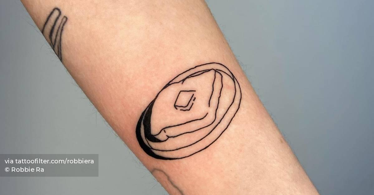 Hand poked toast tattoo located on the inner forearm.