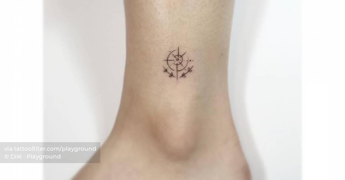 Minimalistic Compass And Laurel Wreath Tattoo Located