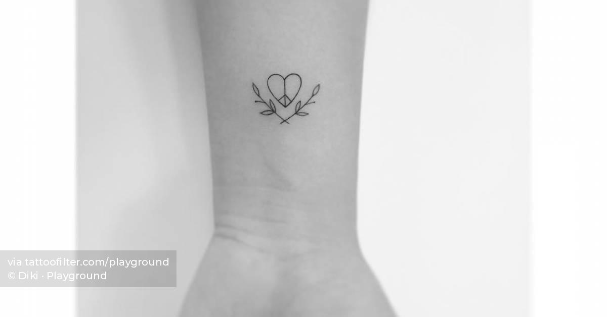 Fine line peace heart and laurel wreath tattoo located