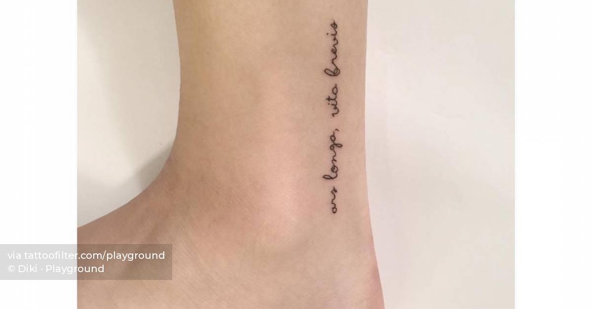 "Ars longa, vita brevis" lettering tattoo located on