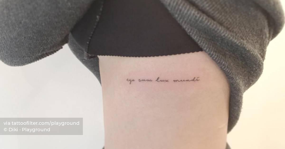 "Ego sum lux mundi" lettering tattoo handwritten on the