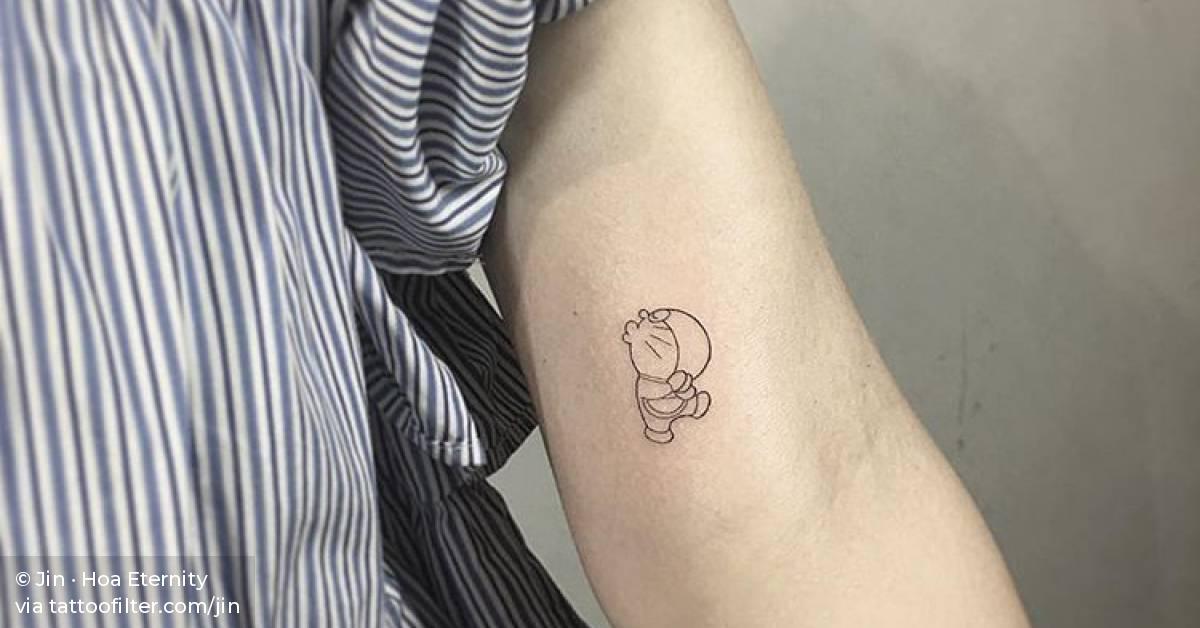 Doraemon tattoo on the left inner arm.