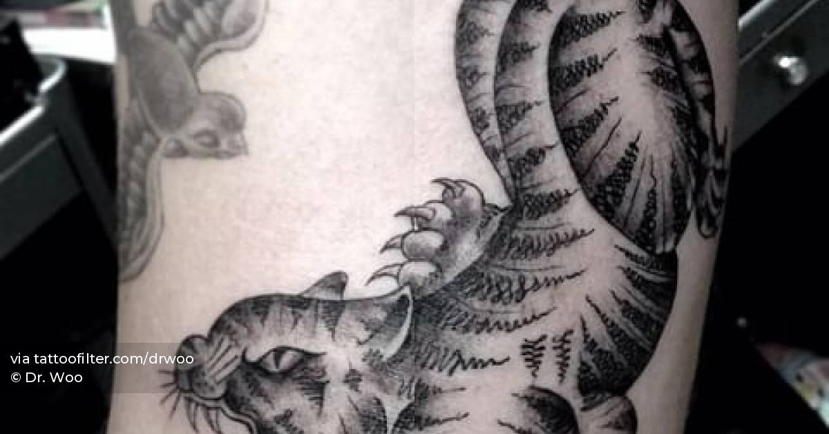 Traditional style tiger tattoo located on the upper