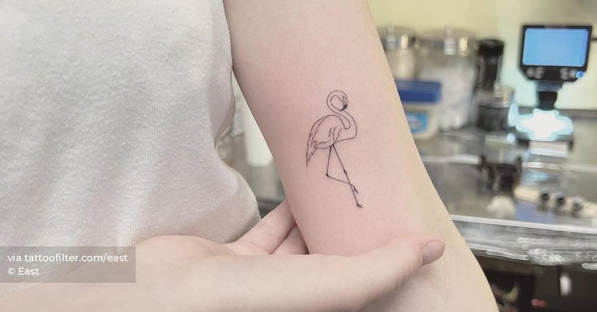 Fine line style flamingo tattoo placed on the inner