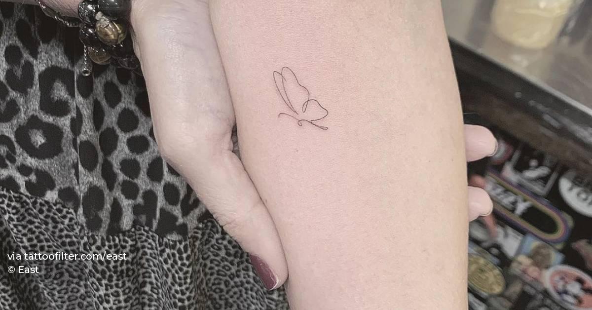 Single needle one line butterfly tattooed on the inner