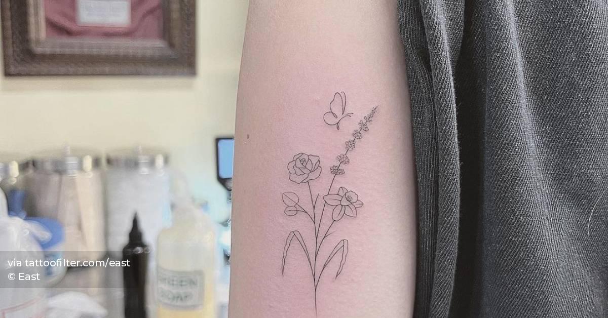 Single needle flower bouquet tattoo located on the