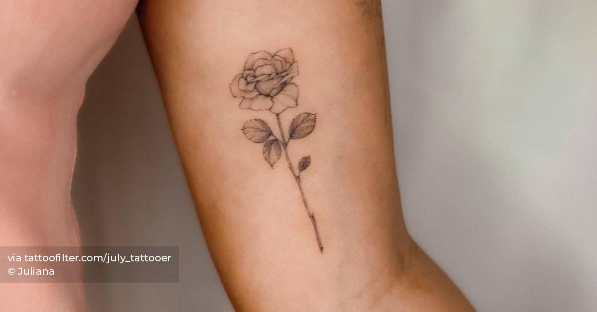 Micro realistic rose tattoo located on the inner arm.