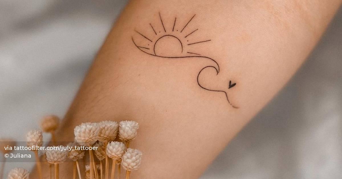 Minimalistic sun and wave tattoo located on the inner