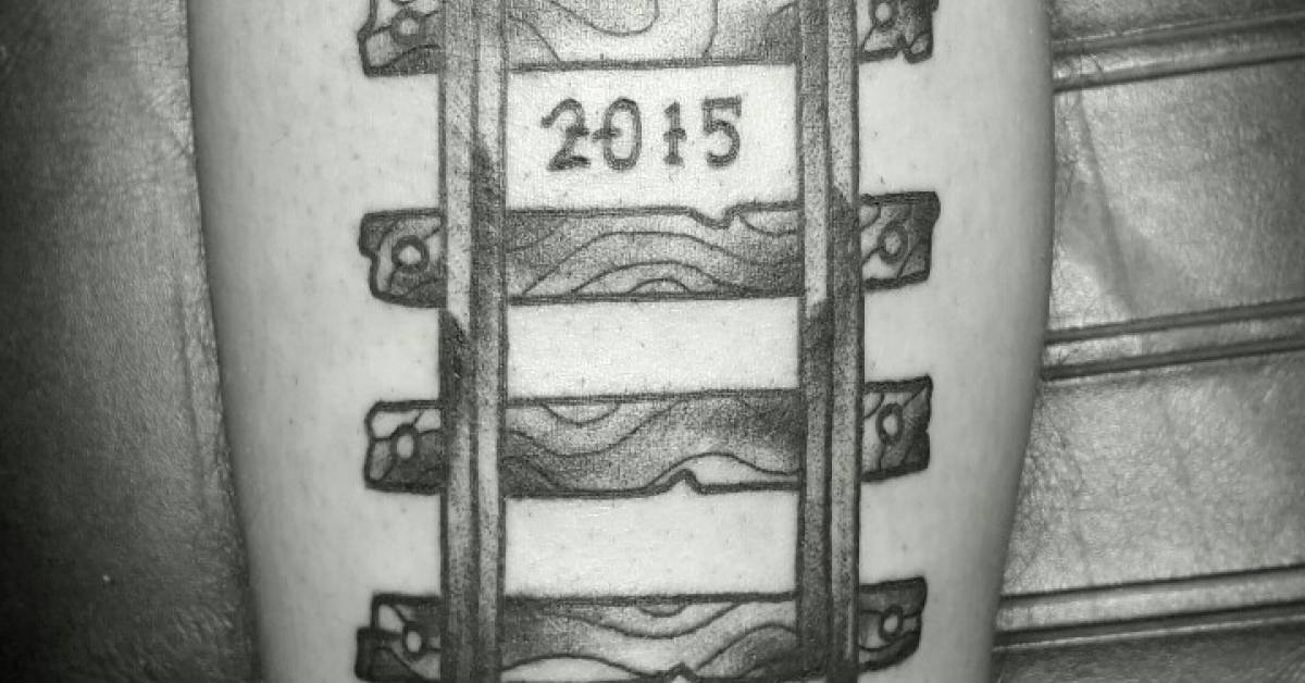 Train railway tattoo on Chris' left leg.
