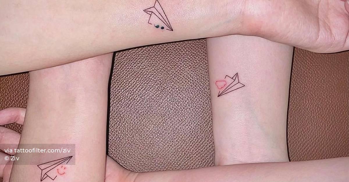 Fine line matching paper planes tattooed for best