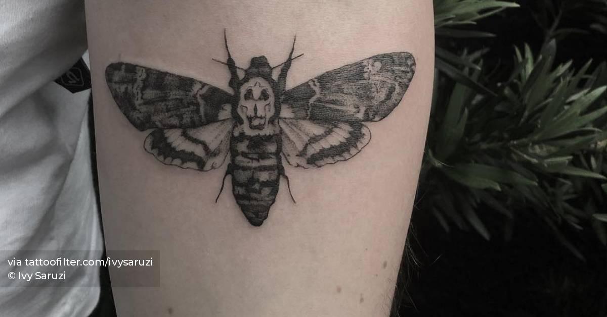 Moth tattoo located on the inner forearm.