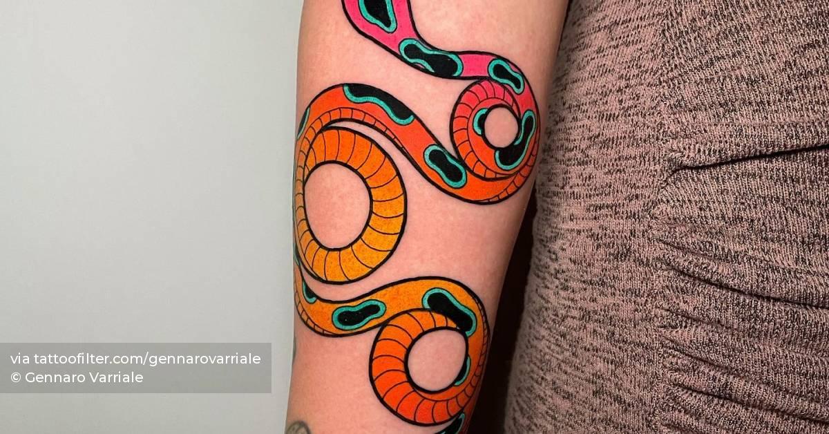 Colorful snake tattoo done on the inner forearm.