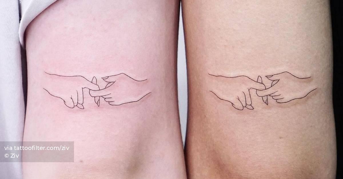 Fine line holding hands tattoo for best friends.