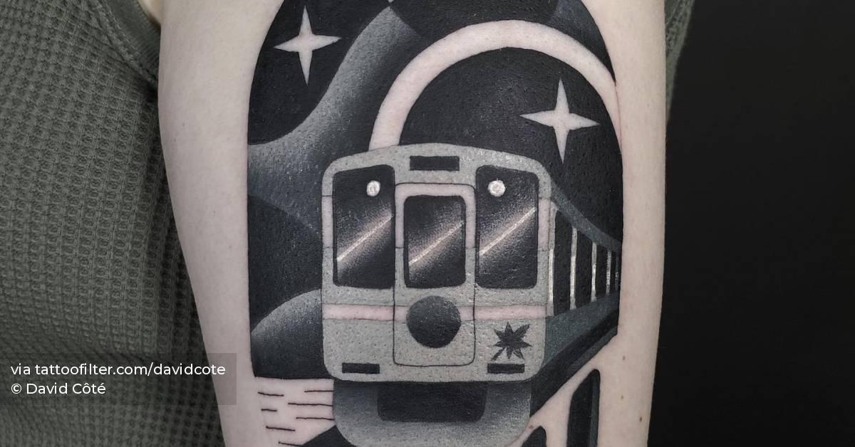 Train tattoo located on the upper arm.