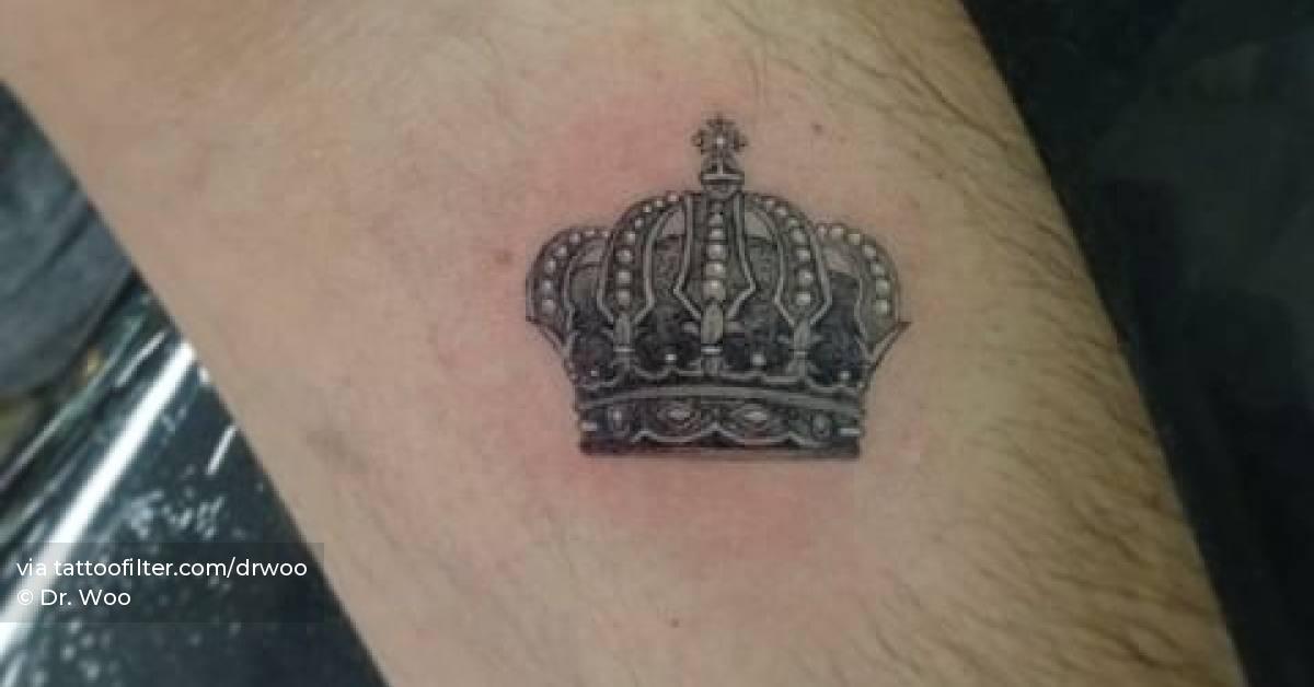 Single needle crown tattoo located on the forearm.