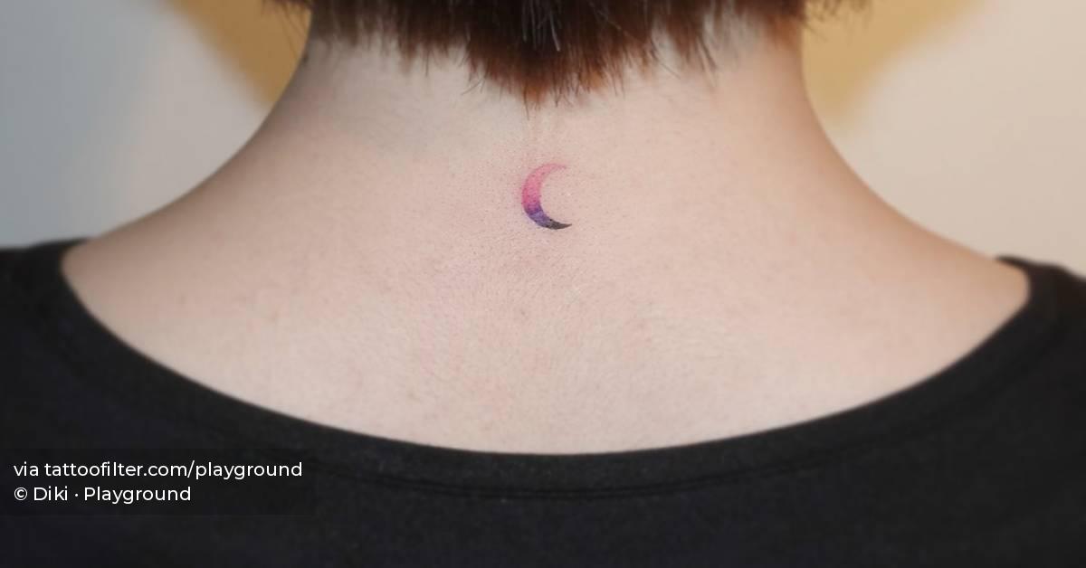Spectrum moon tattooed on the upper back.