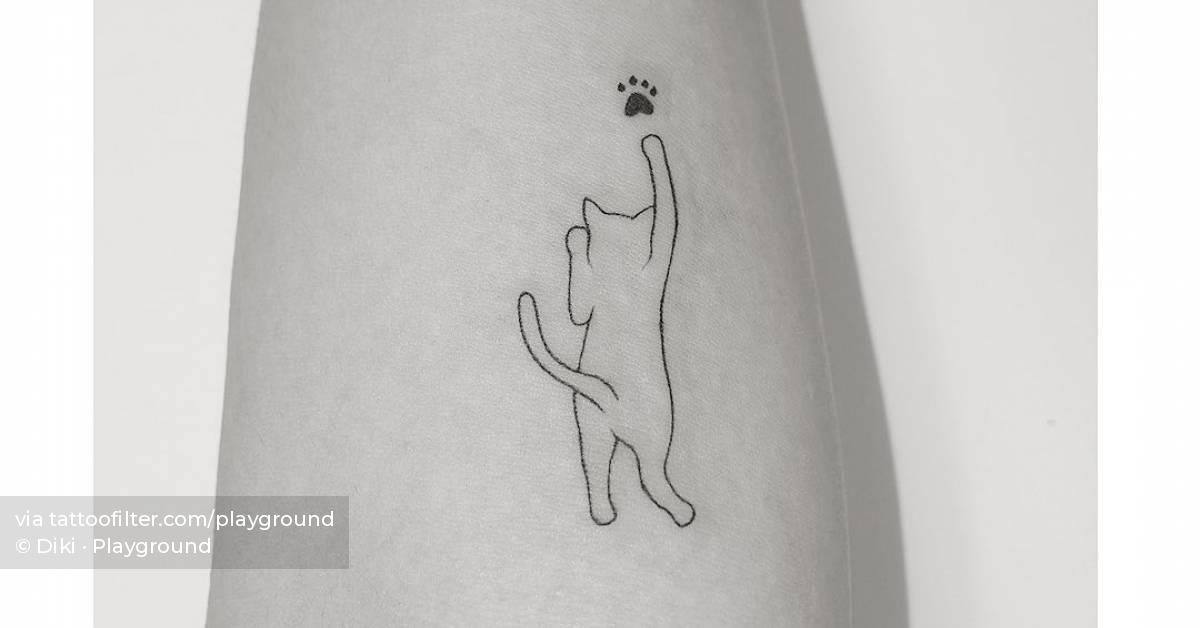 Cat tattoo located on the inner forearm, fine line