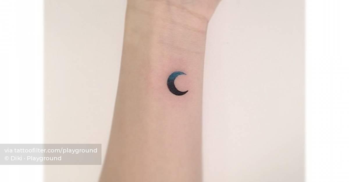 Spectrum moon tattoo located on the wrist.
