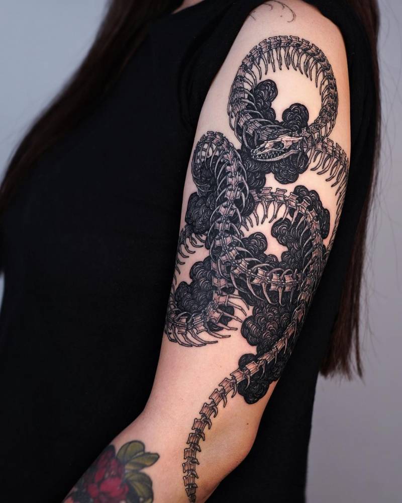 Blackwork Style Skeleton Snake Tattoo Done On The Upper