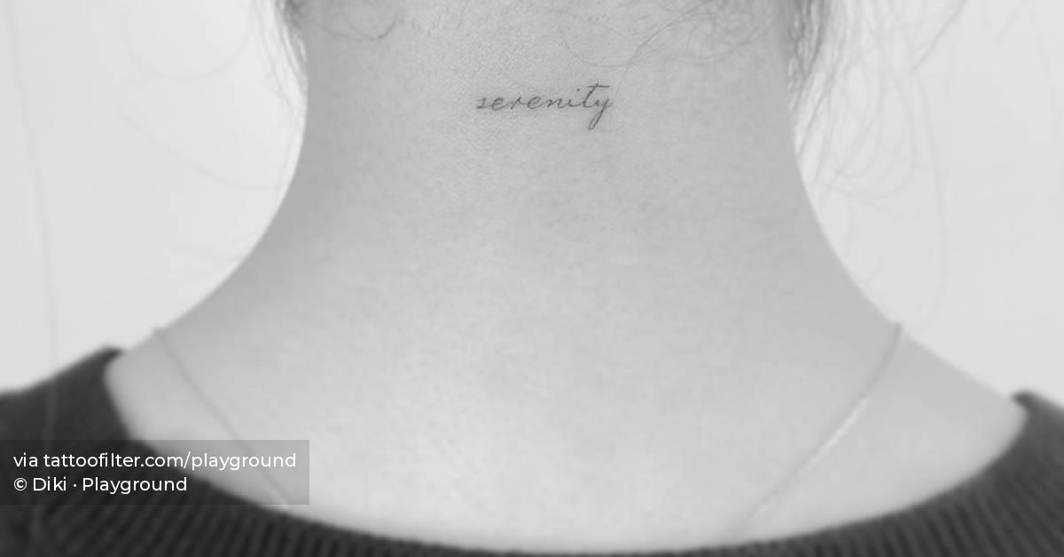 Tattoo of the word "serenity" handwritten on the back