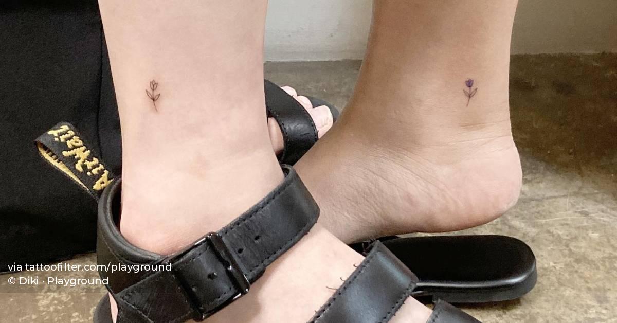 Fine line matching tulip tattoo for best friends.