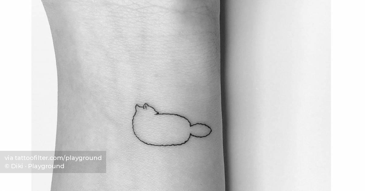 Minimalistic fine line cat tattoo done on the wrist.