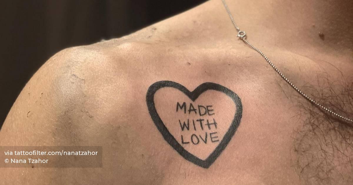 "Made with love" and heart tattooed on the collarbone.
