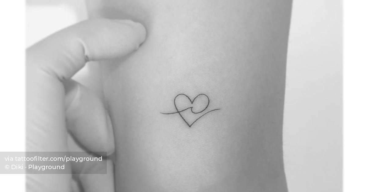 Fine line wave and heart tattoo placed on the inner