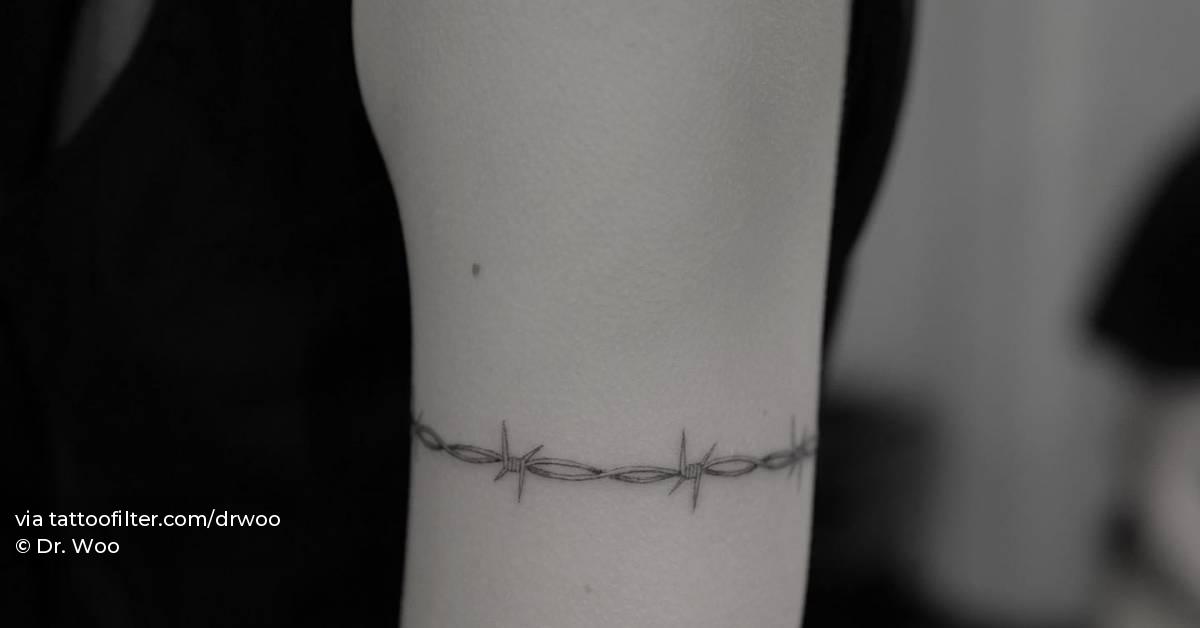 Single needle barbed wire bracelet tattooed on Phoebe