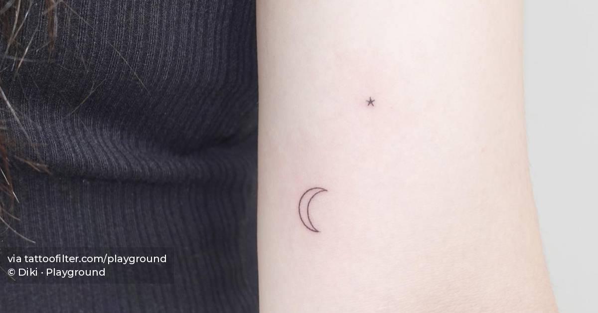 Tiny moon and star tattoo located on the inner arm,