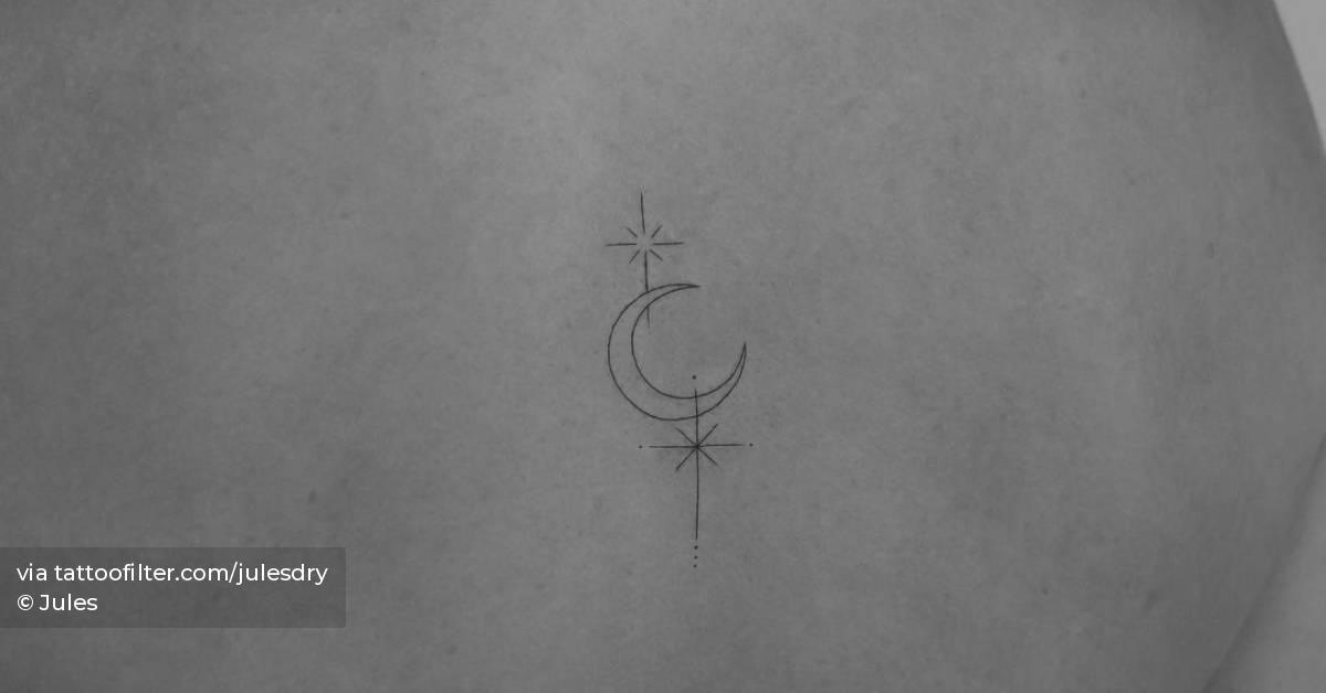 Fine line moon and stars tattoo located on the upper