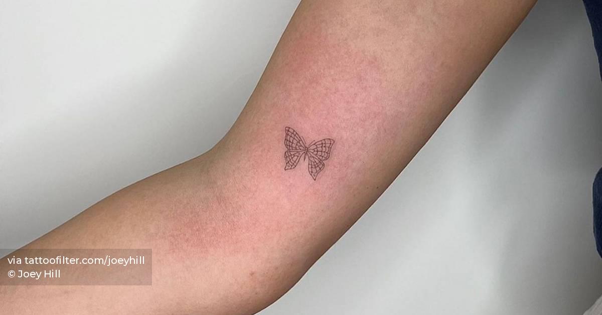 Single needle butterfly tattoo located on the inner