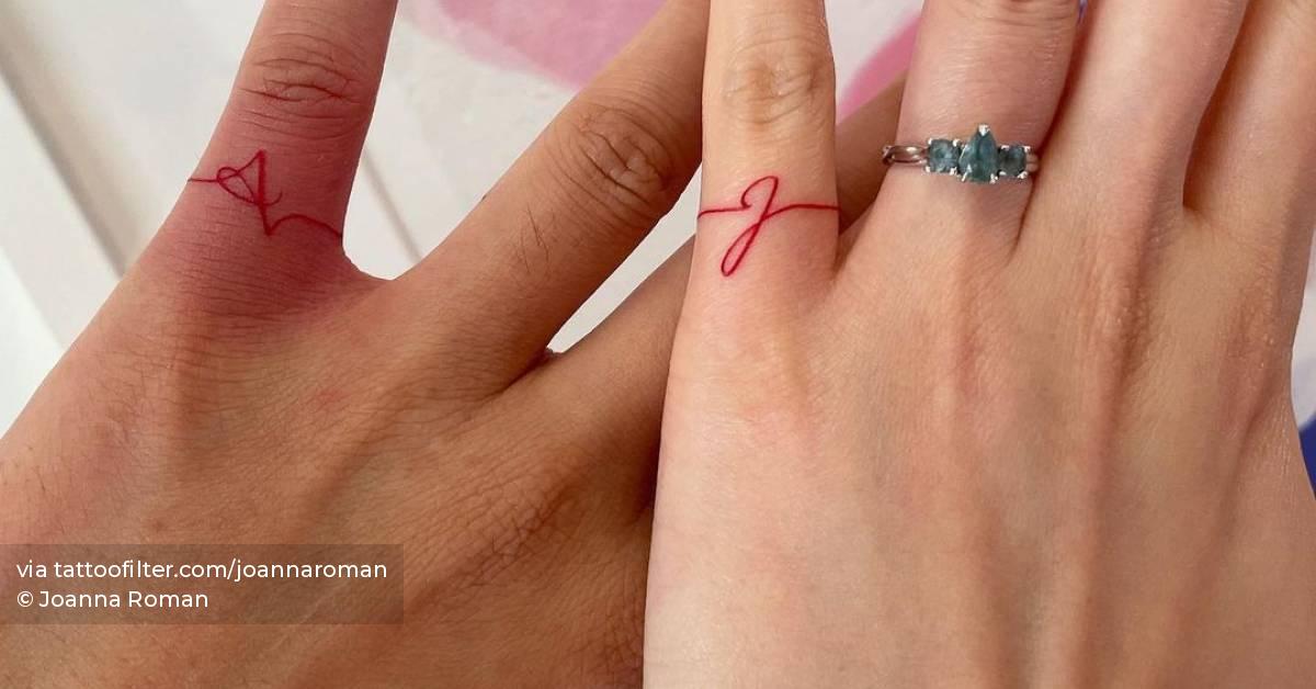 Matching red initials tattoo for best friends.