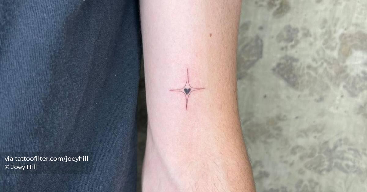 Star and heart tattoo located on the bicep,