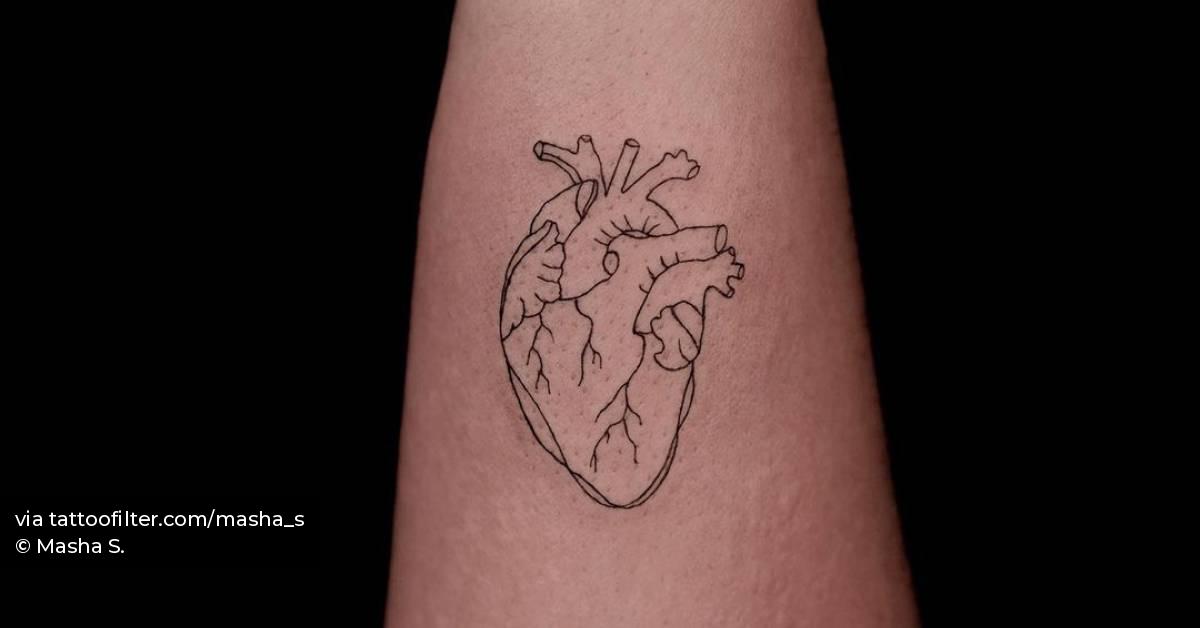 Fine line anatomical heart tattoo done on the wrist.