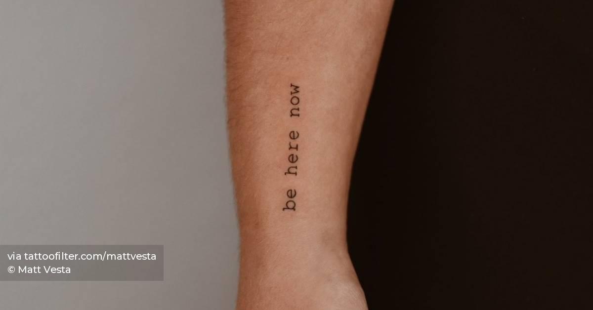 "Be here now" lettering tattoo done on the wrist.