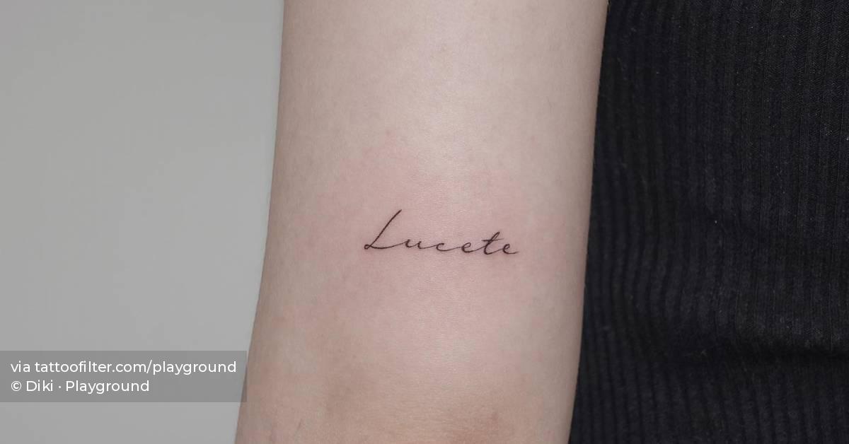 Tattoo of the word "lucete" located on the tricep.