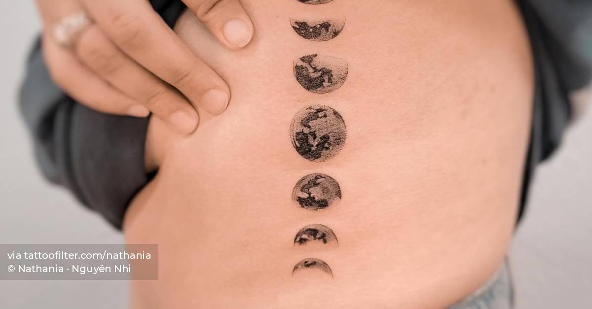 Moon phases tattoo located on the rib.