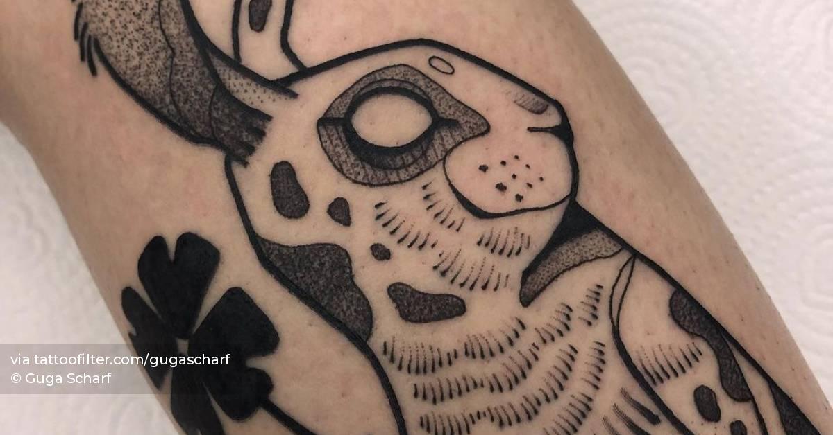 Blackwork rabbit tattoo on the inner forearm.