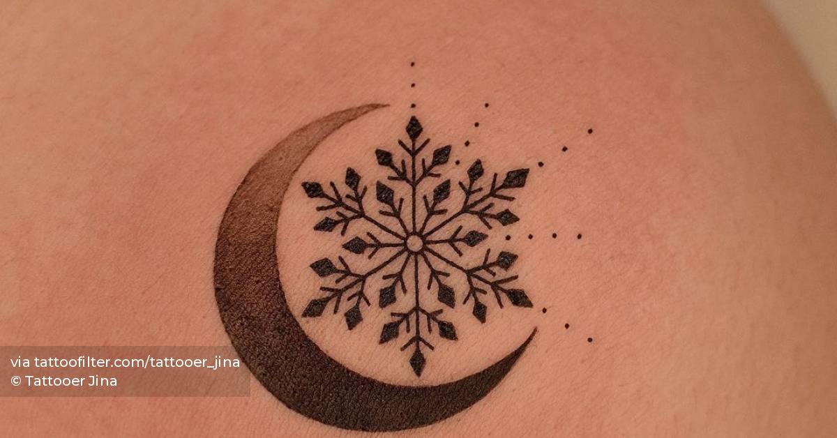 Black snowflake and crescent moon tattoo