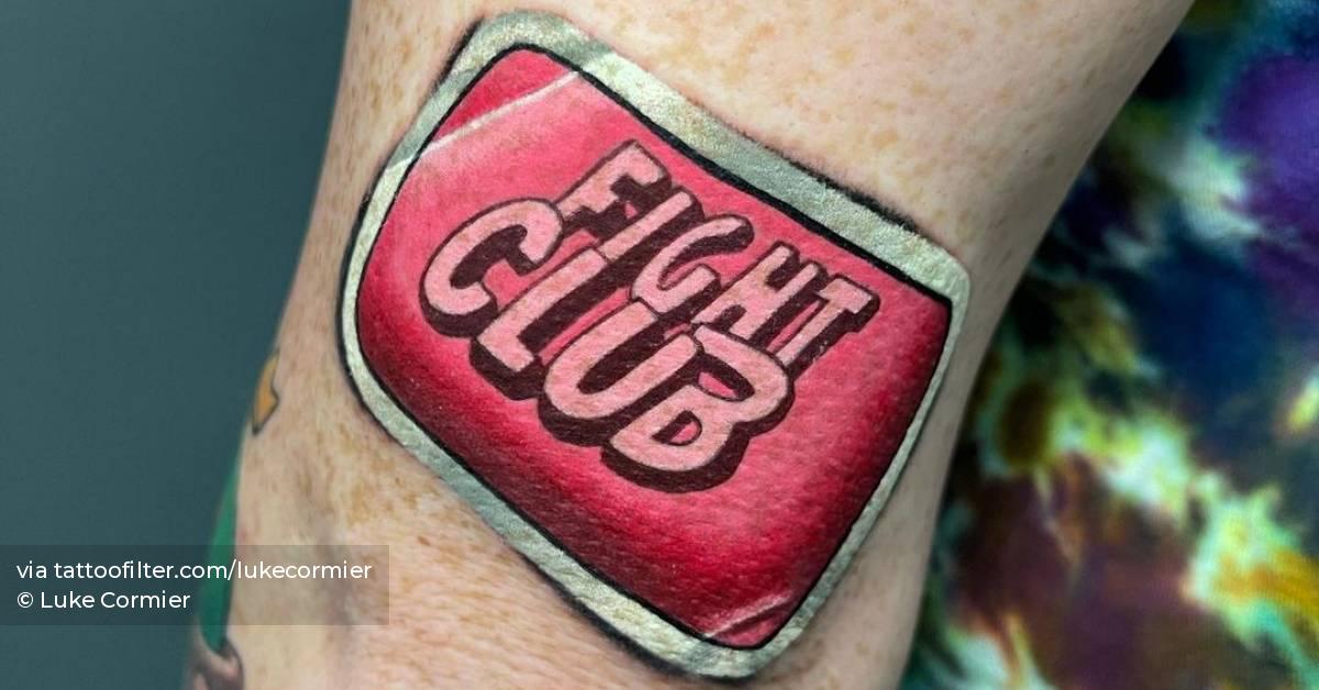 'Fight Club' sticker tattoo on the tricep.