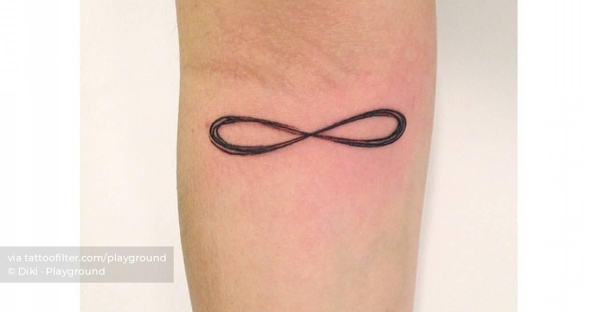 Infinity symbol tattooed on the inner forearm.