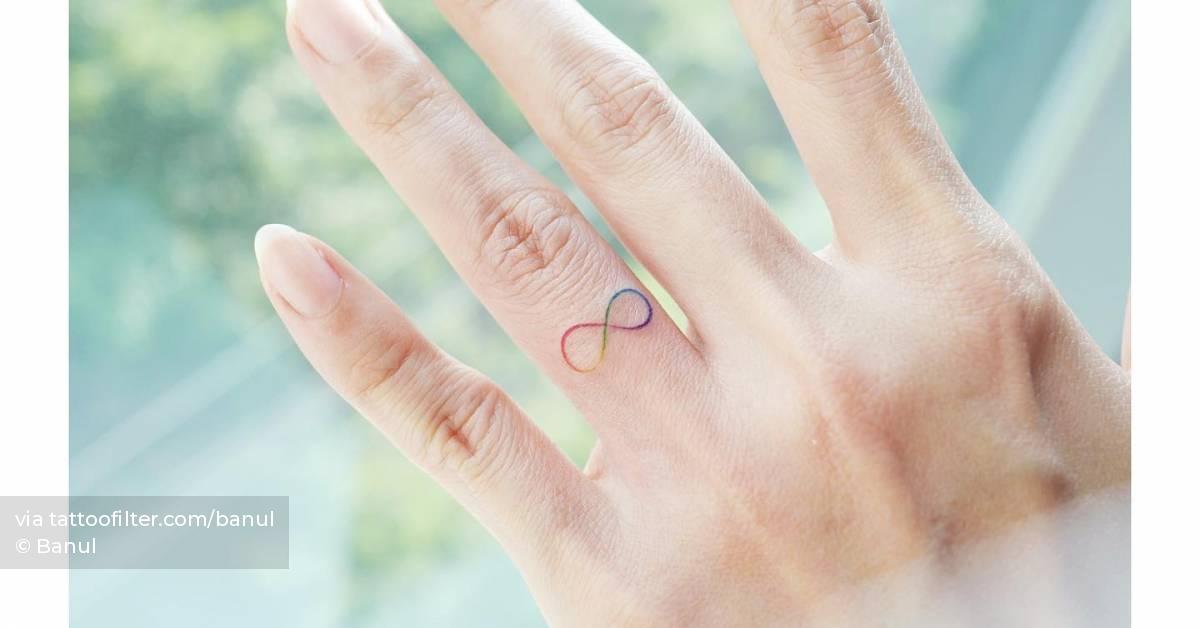 Mini infinity symbol tattoo located on the finger.