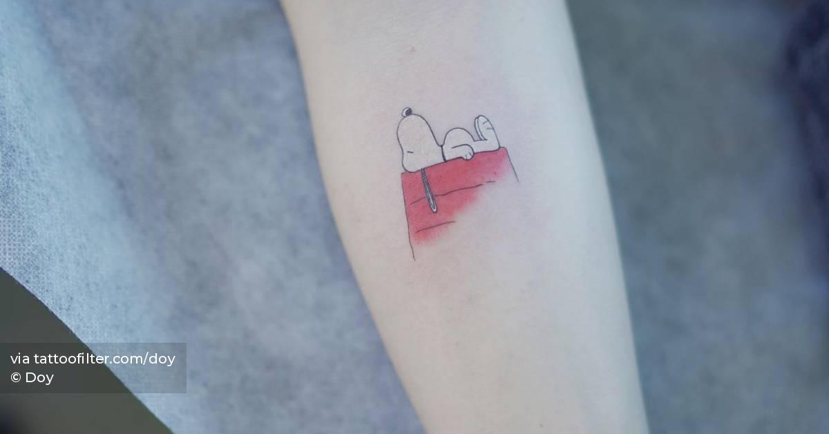 Snoopy tattoo located on the inner forearm, cartoon