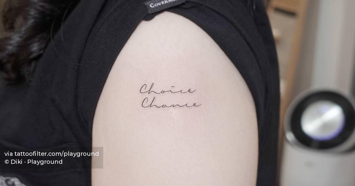 "Choice" and "chance" lettering tattoo located on the