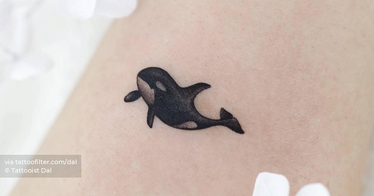 Small orca tattoo located on the inner foreram.